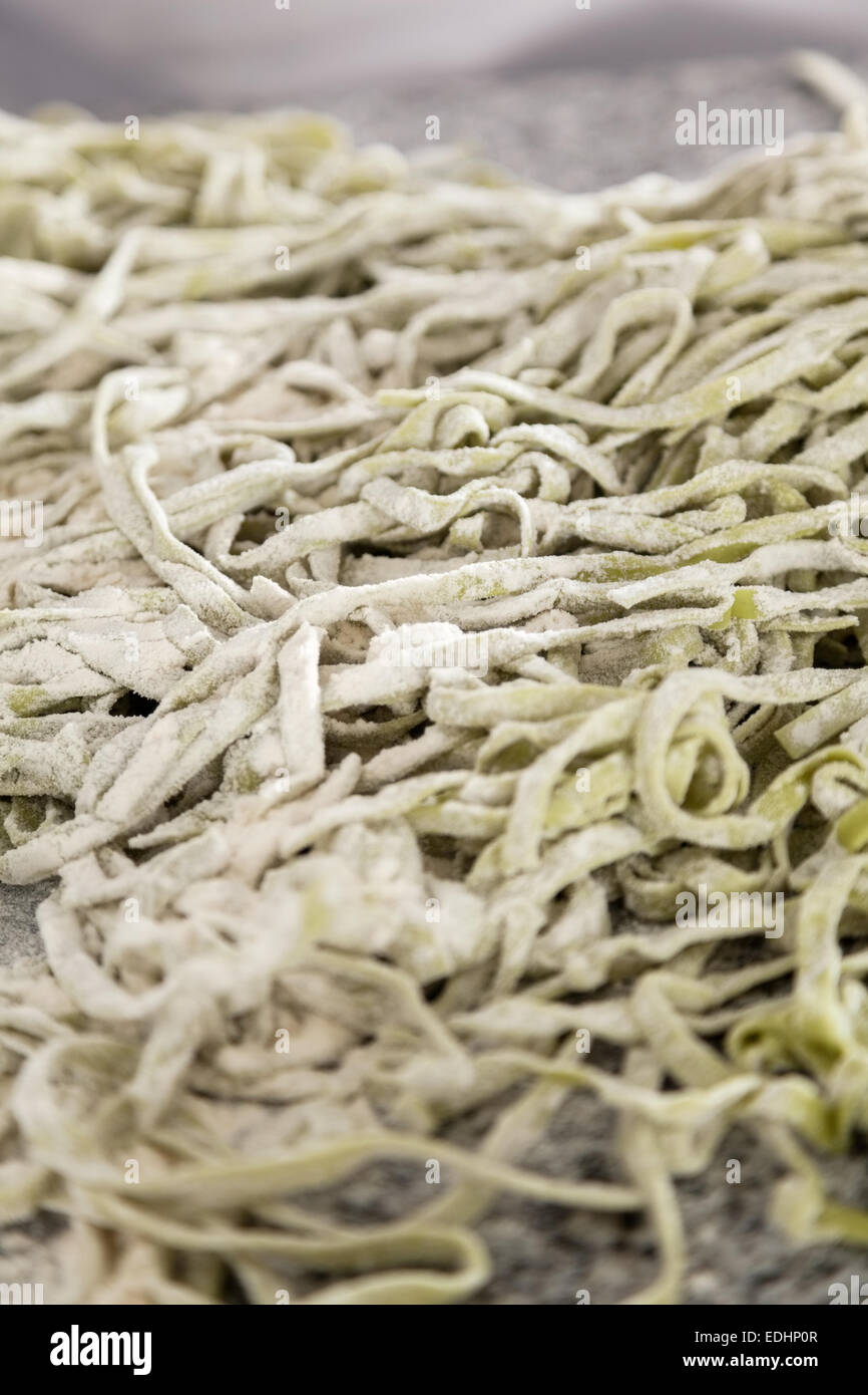 Raw Green Spaghetti Pasta On Counter Stock Photo - Alamy