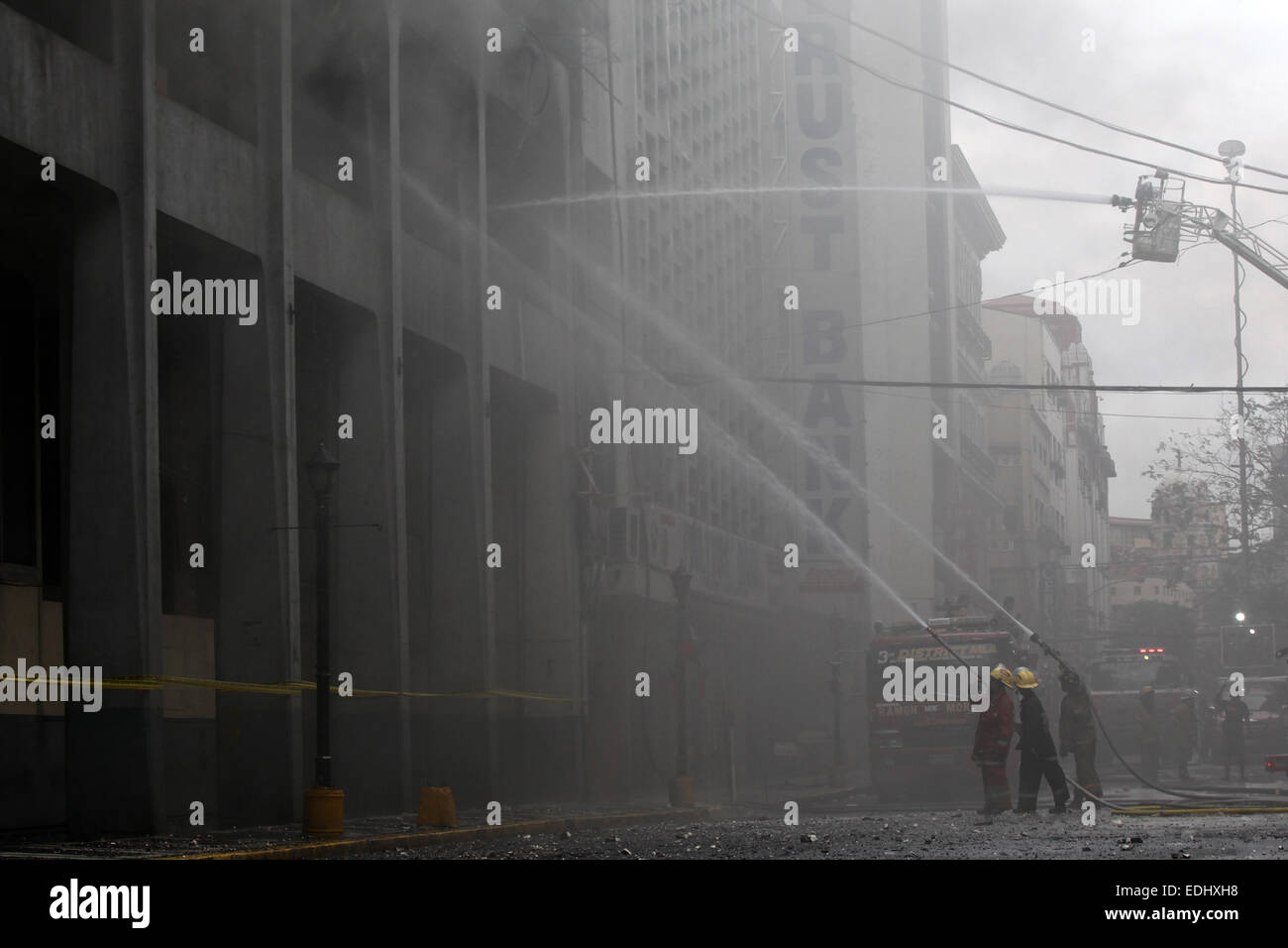 Manila, Philippines. 7th Jan, 2015. Firefighters try to extinguish a ...