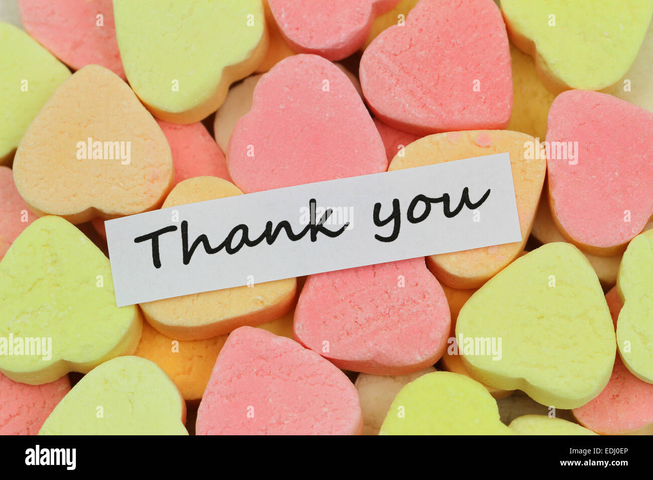 Thank you card with colorful sugar hearts Stock Photo - Alamy