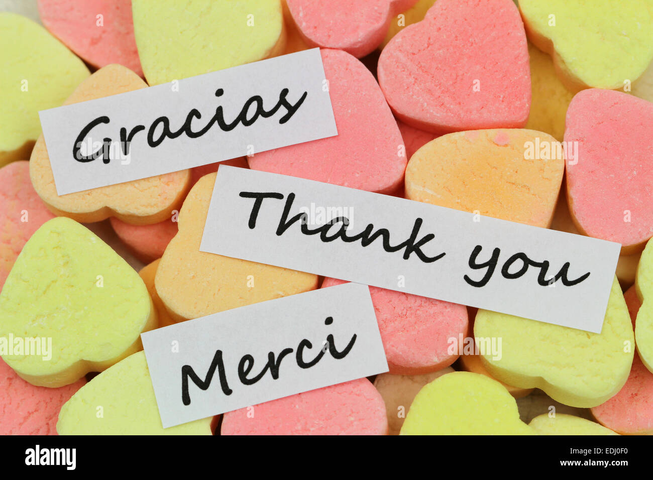 Thank you card with colorful sugar hearts Stock Photo - Alamy