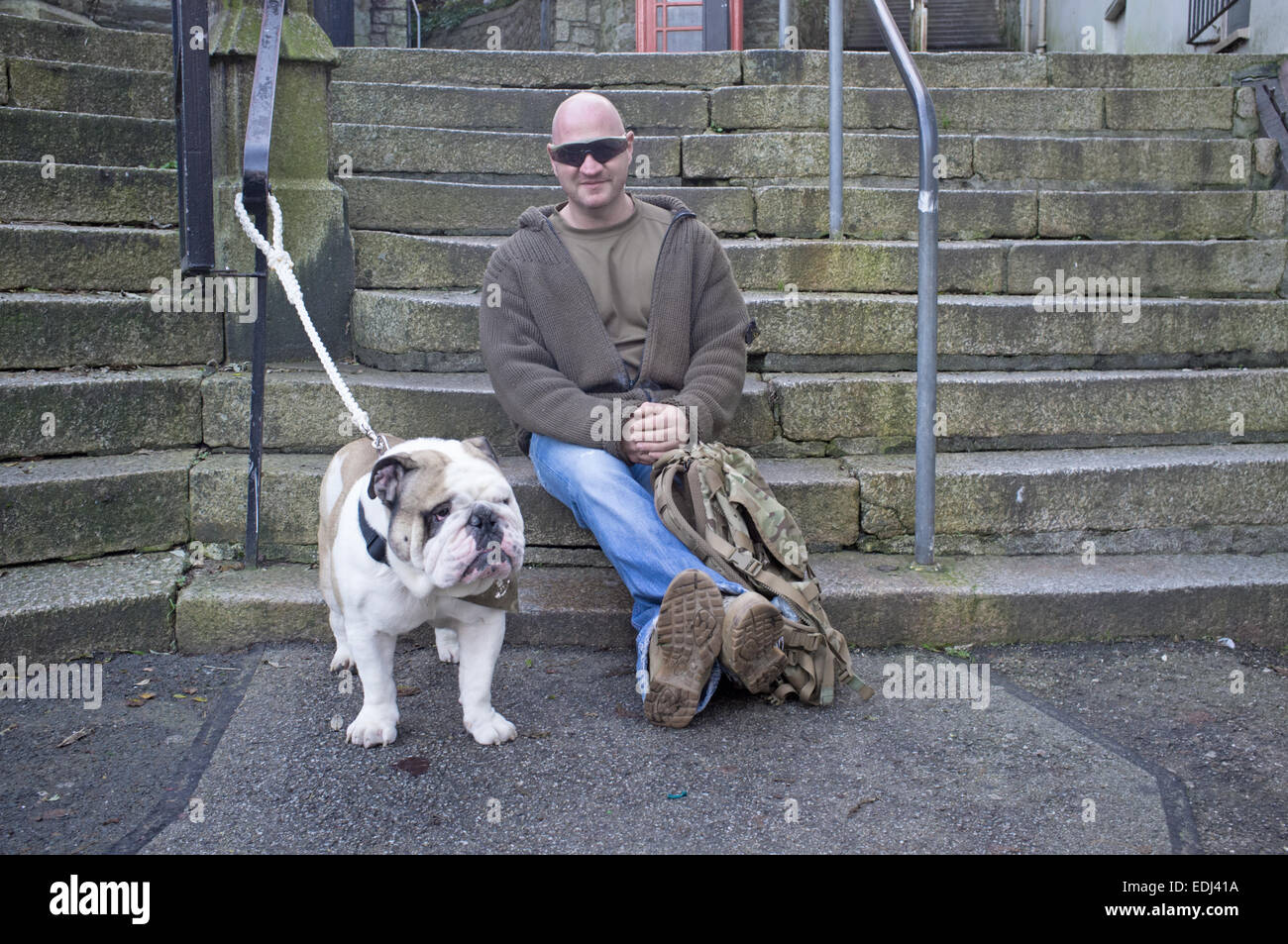 A man with his bulldog in Falmouth, UK Stock Photo - Alamy