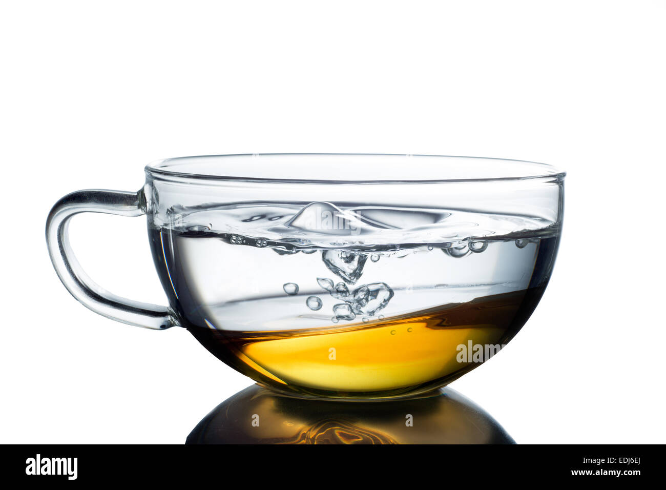 Tea and water in glass cup isolated on white Stock Photo - Alamy