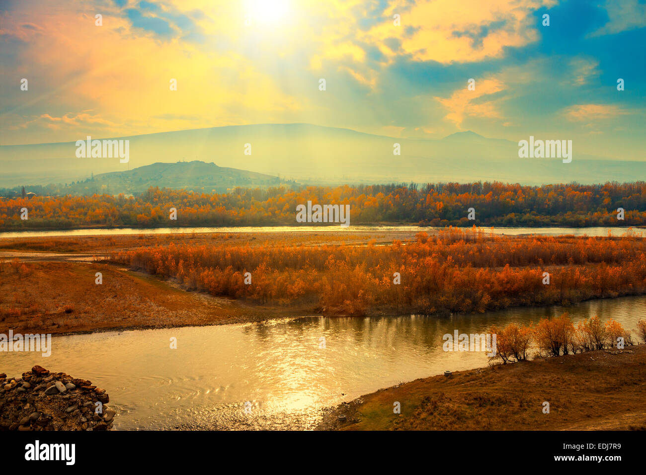 Foggy sunset over mountain river Stock Photo - Alamy