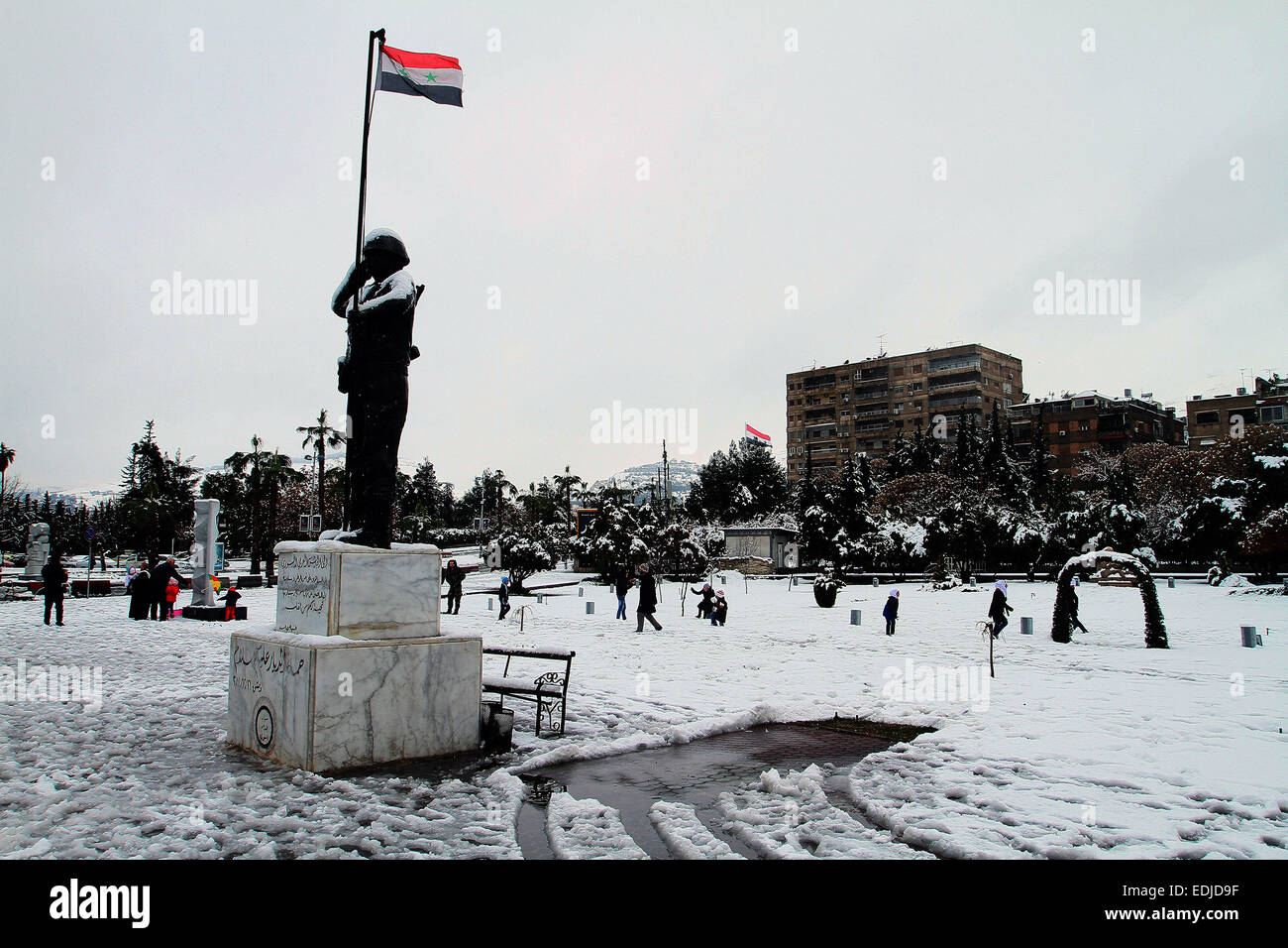Damascus, Syria. 7th Jan, 2015. Syrians play on a snow-covered street ...