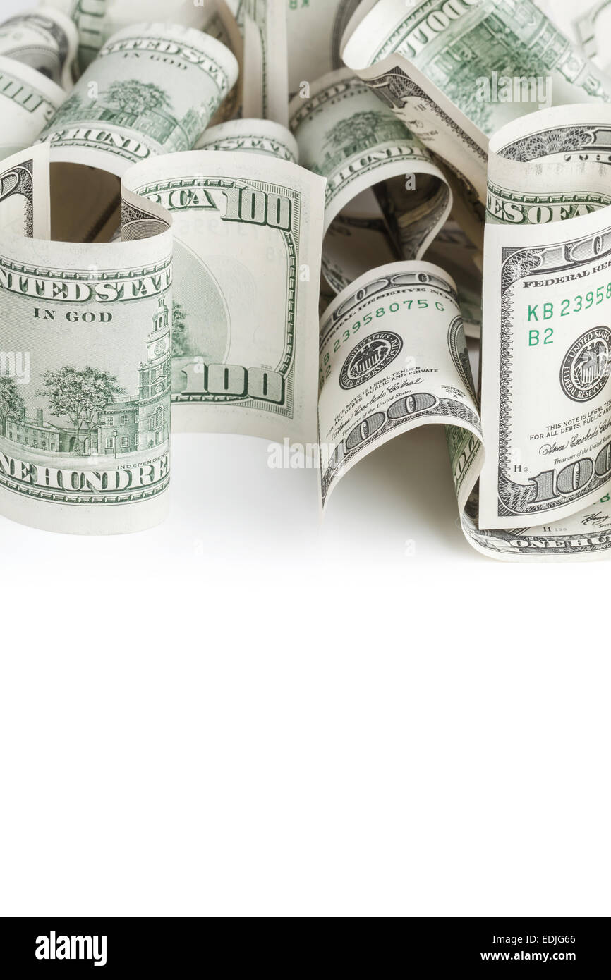 Pile of United States dollar hundred USD banknotes on white table with ...