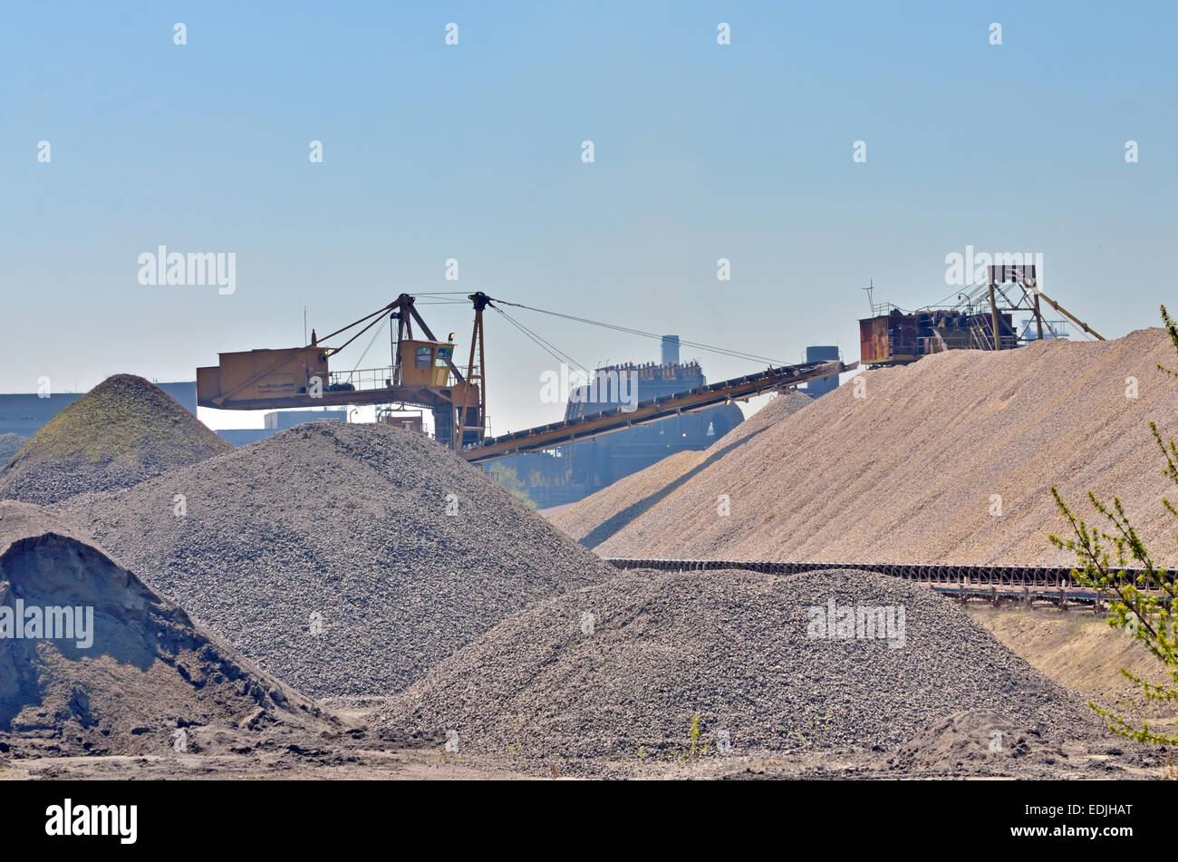 Heavy excavator loader at soil moving works at quarry Stock Photo - Alamy