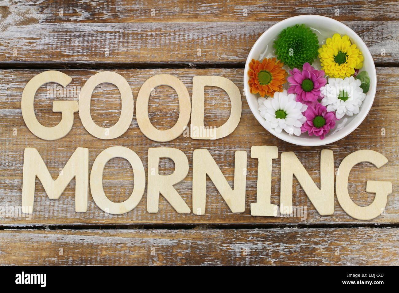 Good morning written with wooden letters and santini flowers Stock ...