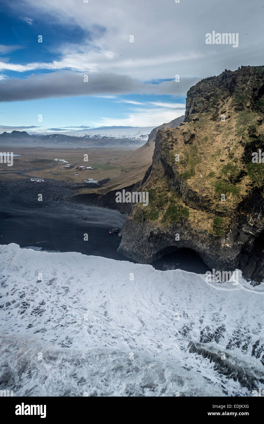 Aerial view of cliffs, and waves, black sand beach, Dyrholaey, Iceland ...