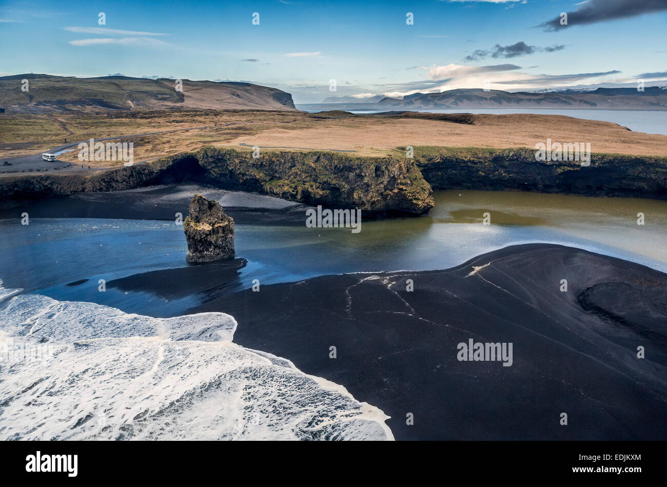 Aerial view of cliffs and waves, black sand beach, Dyrholaey, Iceland ...