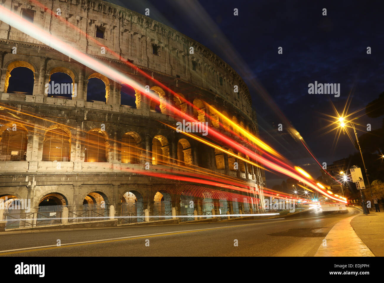 Coliseum at night with car lights, Rome, Italy Stock Photo - Alamy