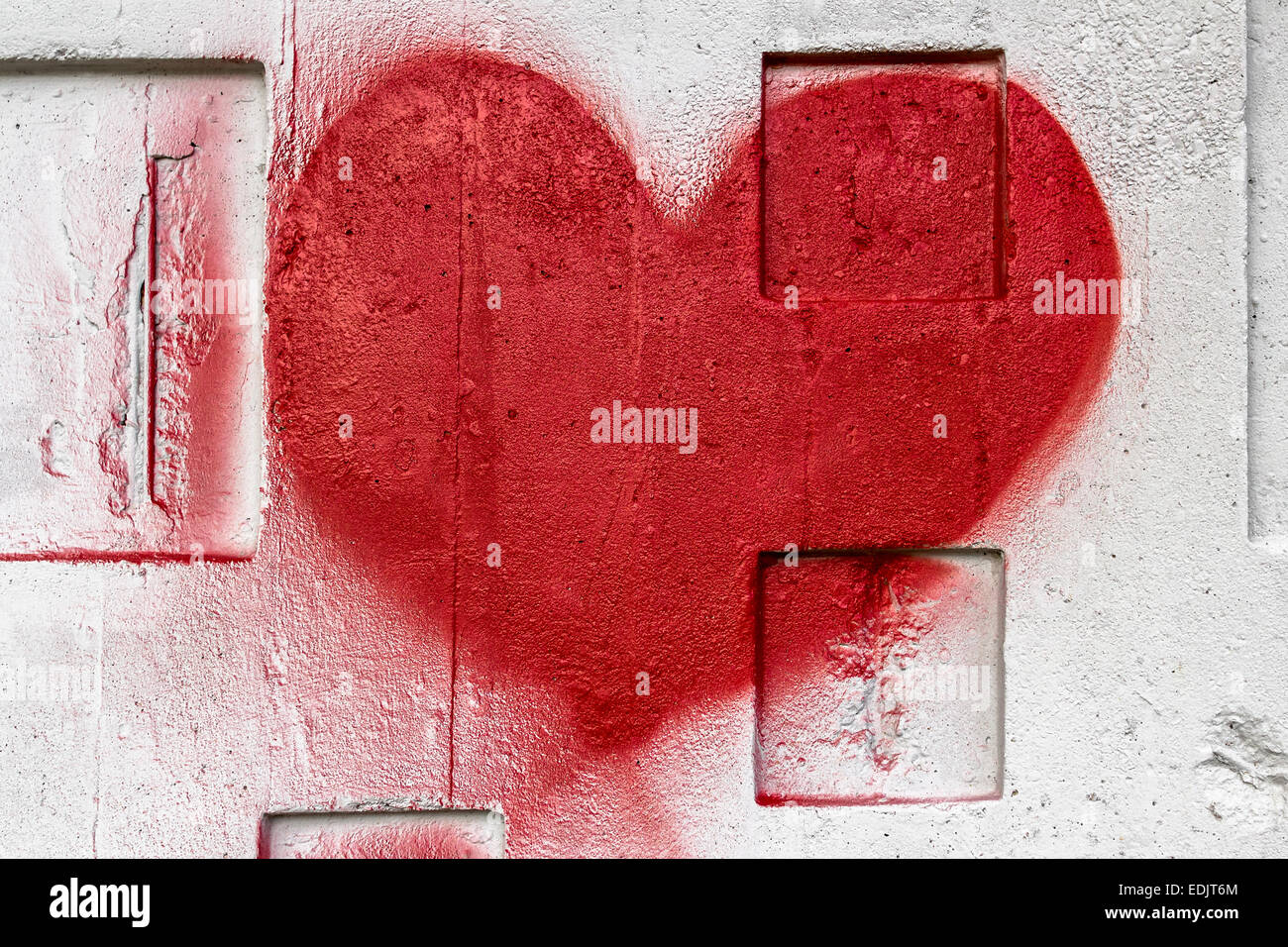 A red heart painted with love on a wall Stock Photo - Alamy