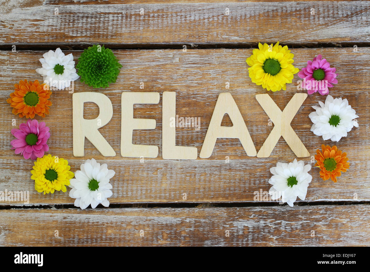Relax written with wooden letters on rustic surface with santini ...