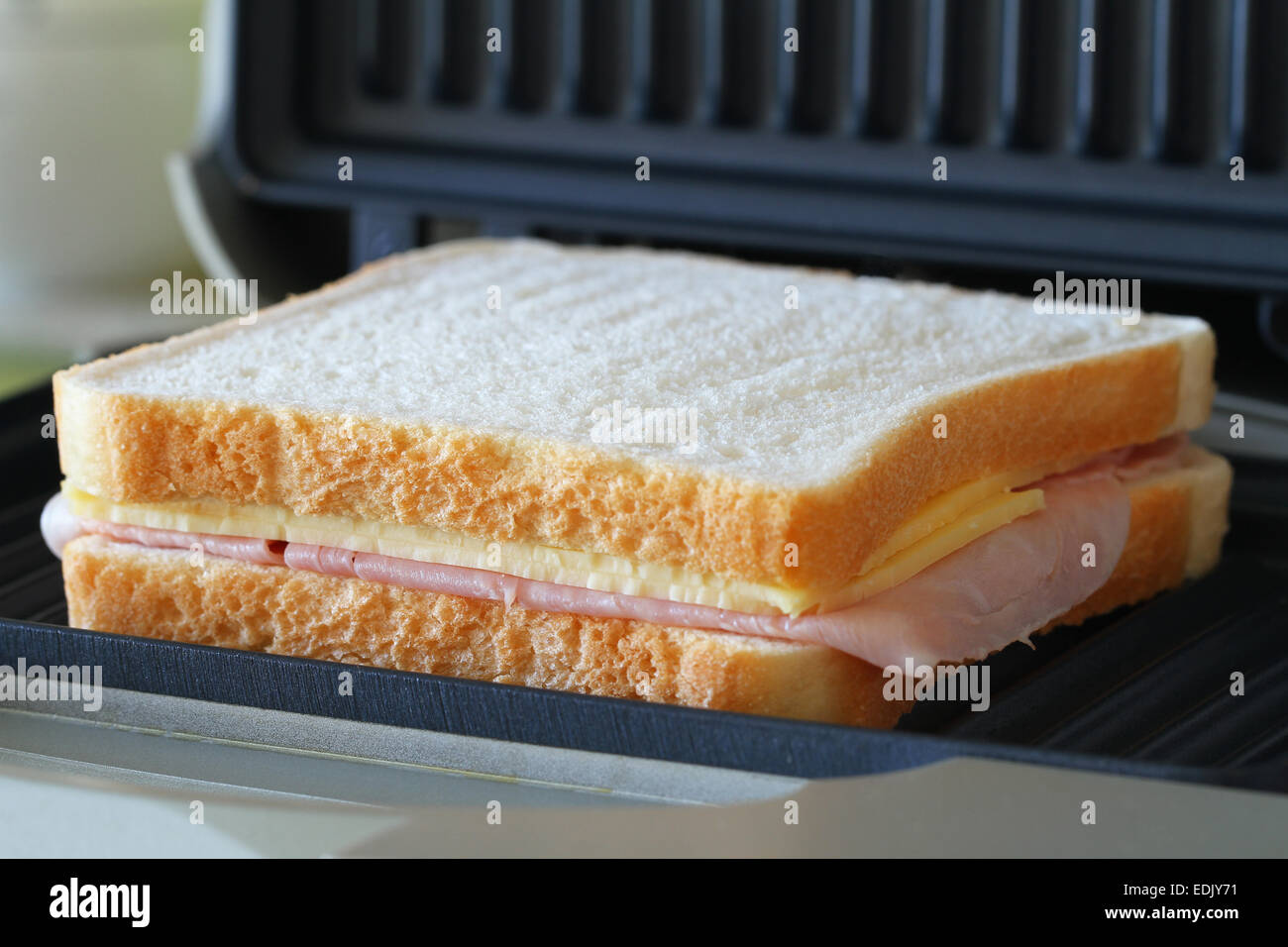 Toast with ham and cheese in toaster Stock Photo - Alamy