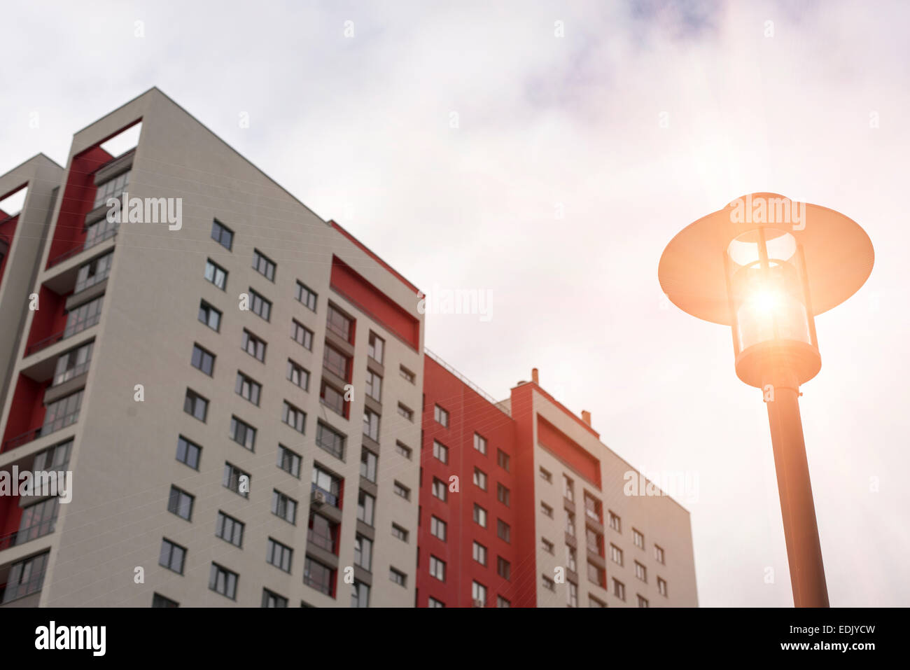 Glowing street light on background of high residential building Stock ...