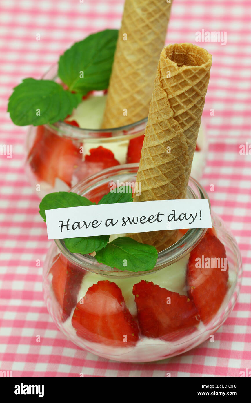 Have a sweet day with creamy dessert with strawberries Stock Photo - Alamy