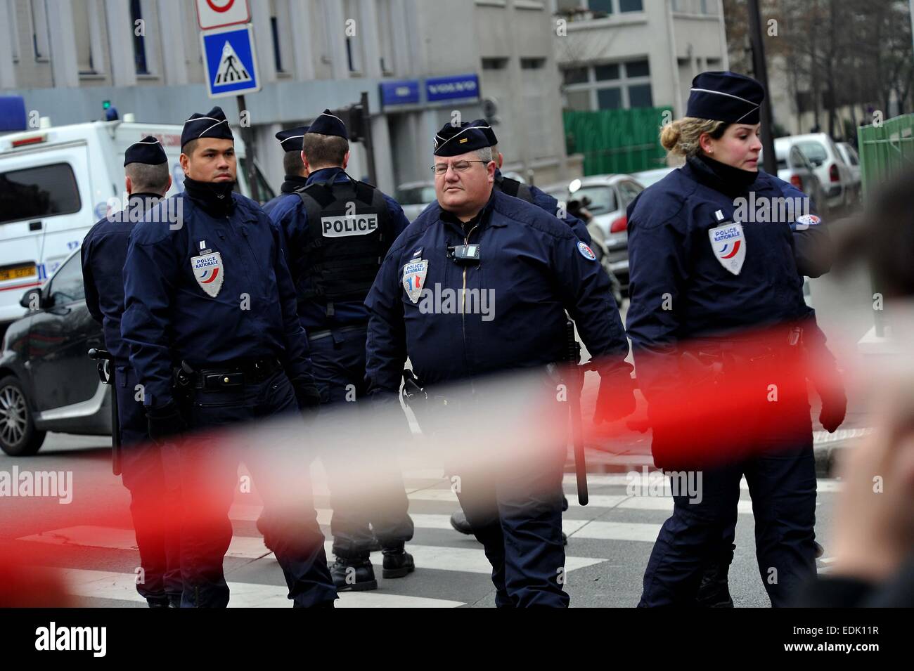 Paris, France. 7th Jan, 2015. French police officers stand guard near ...