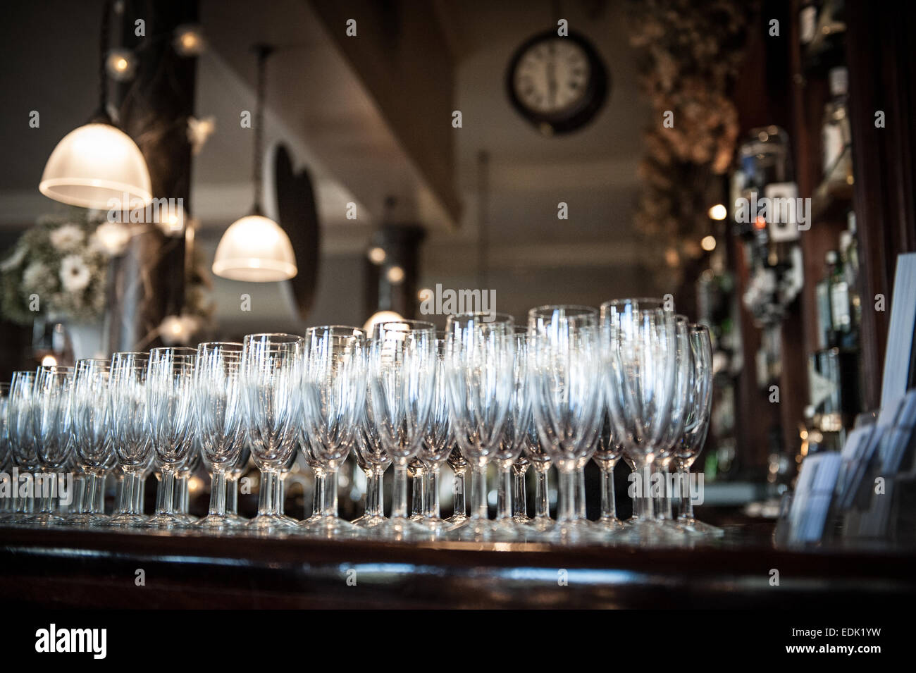 Champagne flutes on bar Stock Photo - Alamy