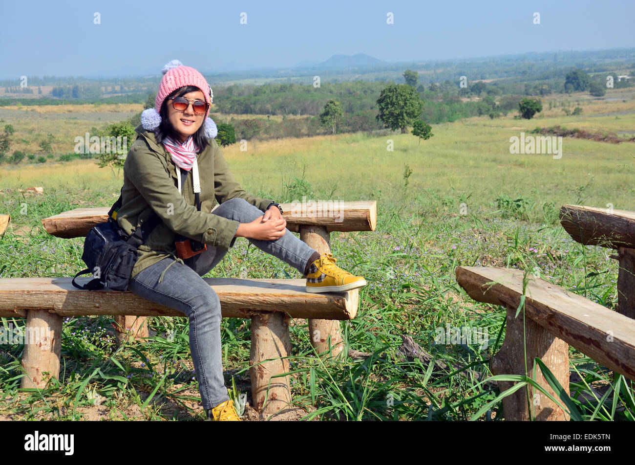 Thai woman sit for rest at Viewpoint in winter season at Ban Kha is a ...