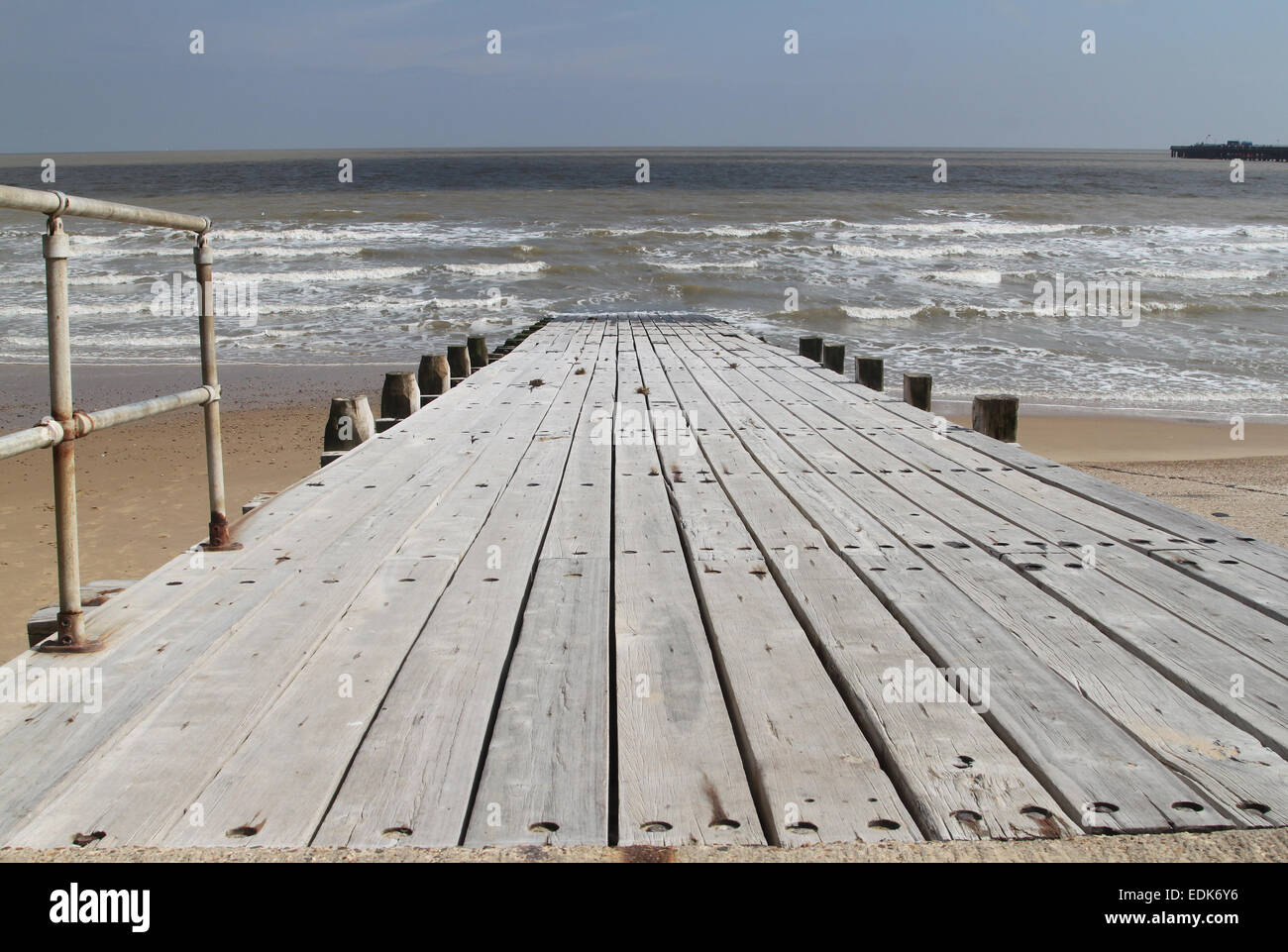 Wooden ramp for launching boats into sea, Walton-on-the Naze, Essex ...
