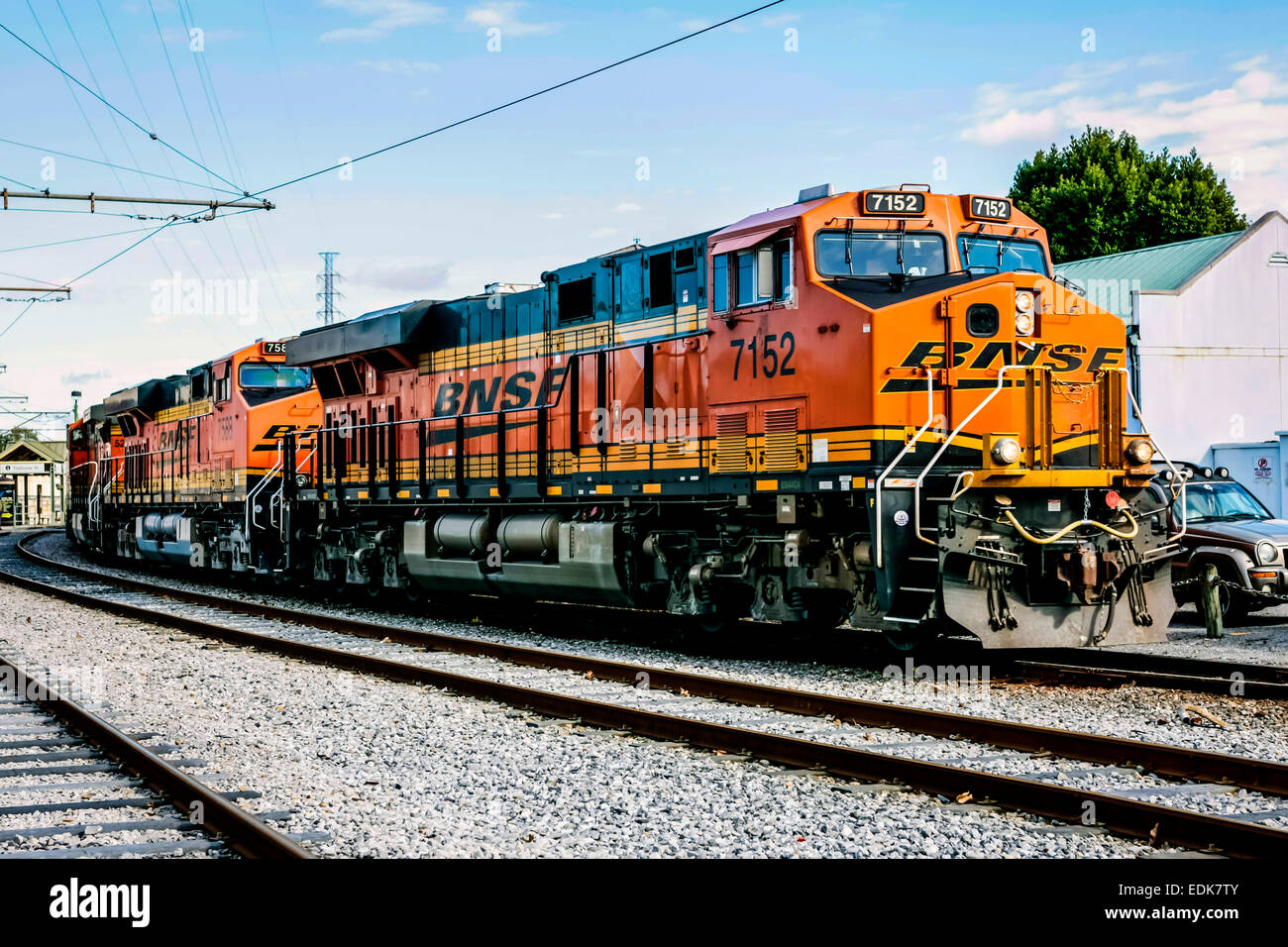 A Burlington North and Santa Fe (BNSF) C44-9W locomotive leads an oil train through New Orleans ...
