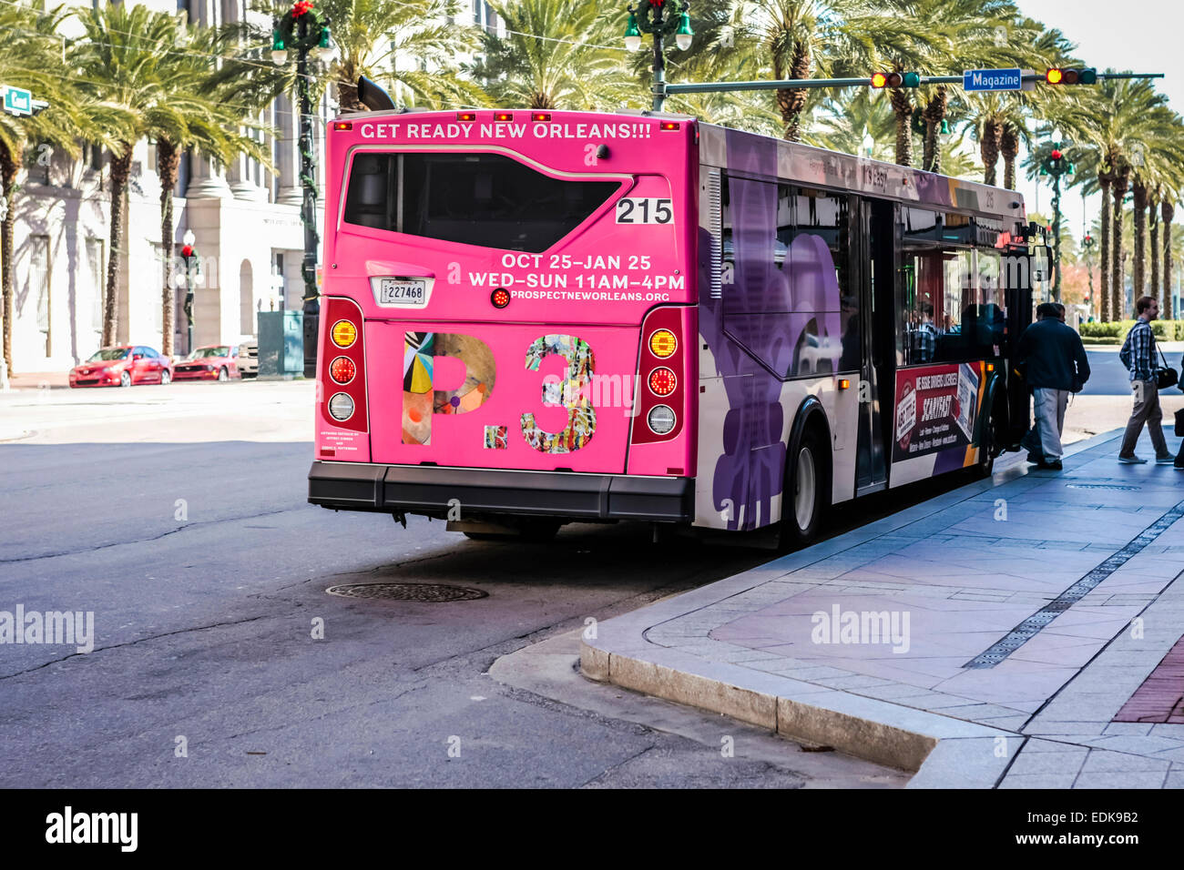 Brightly colored public transport bus on Canal Street in New Orleans LA ...