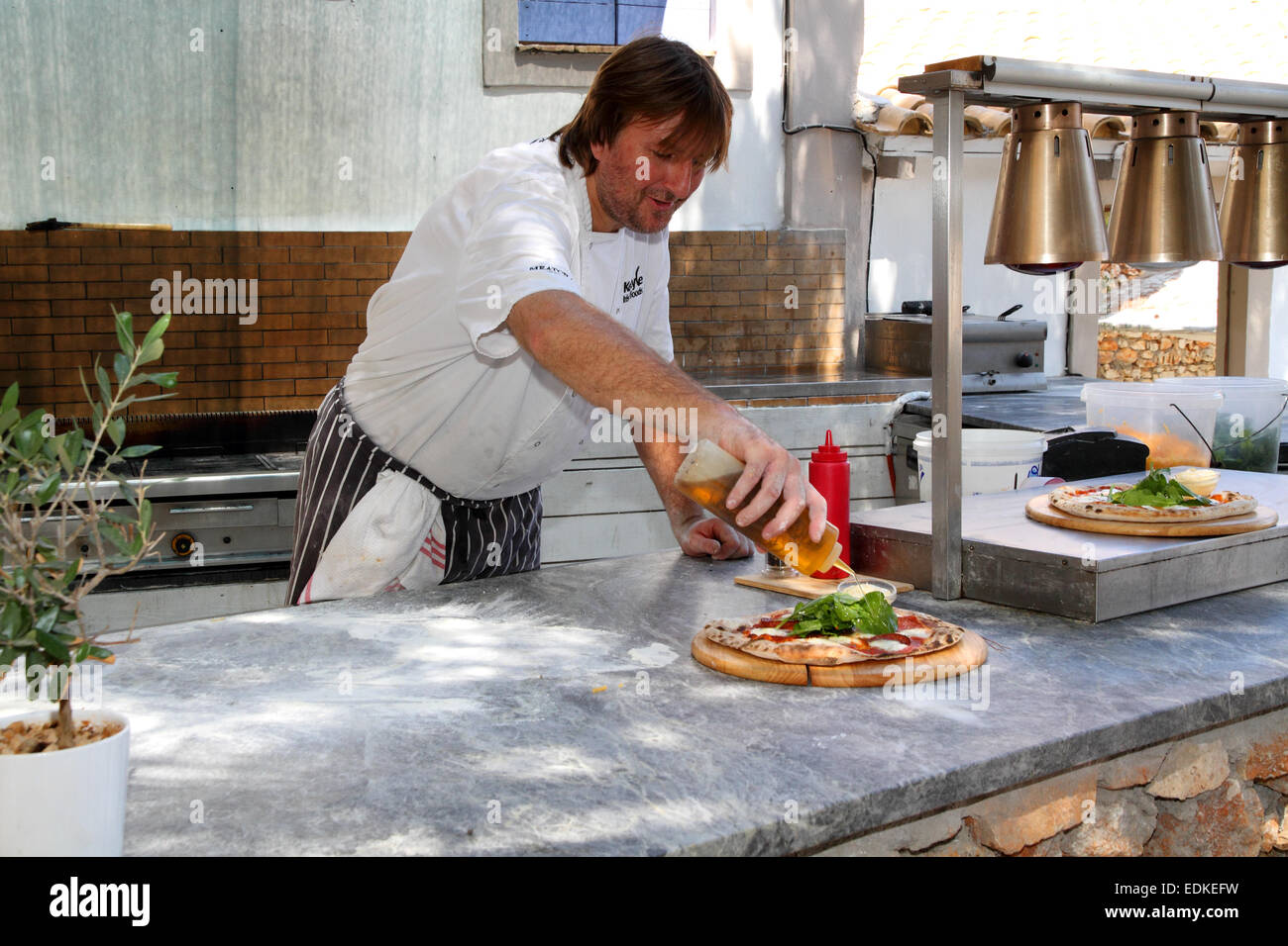 Making pizza hi-res stock photography and images - Alamy