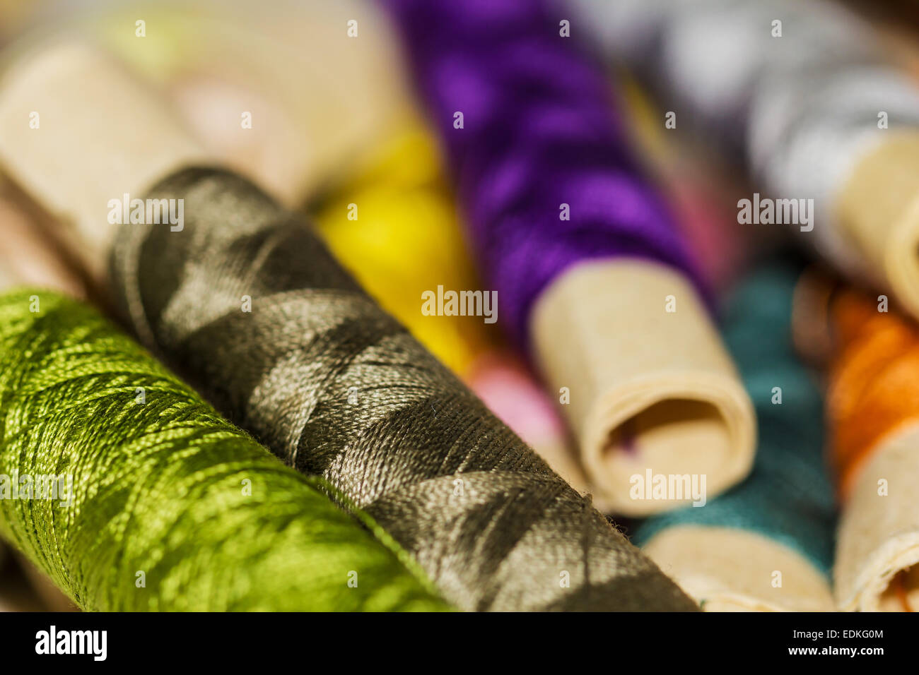 Colorful Sewing Thread Pattern. Colorful miniature bobbins of thread ...