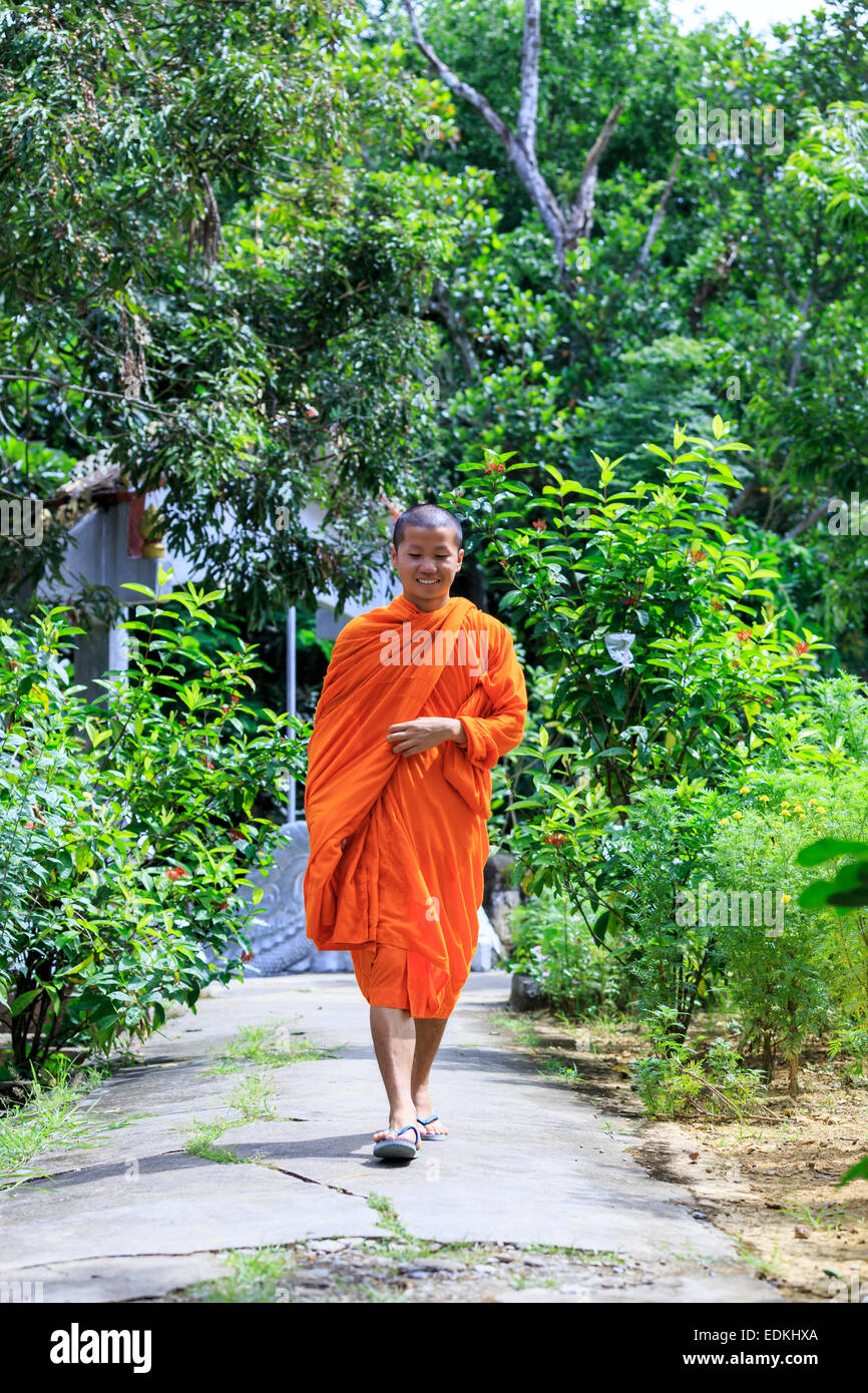 Young Buddhist Monk Walking And Smiling To The Camera Stock Photo - Alamy