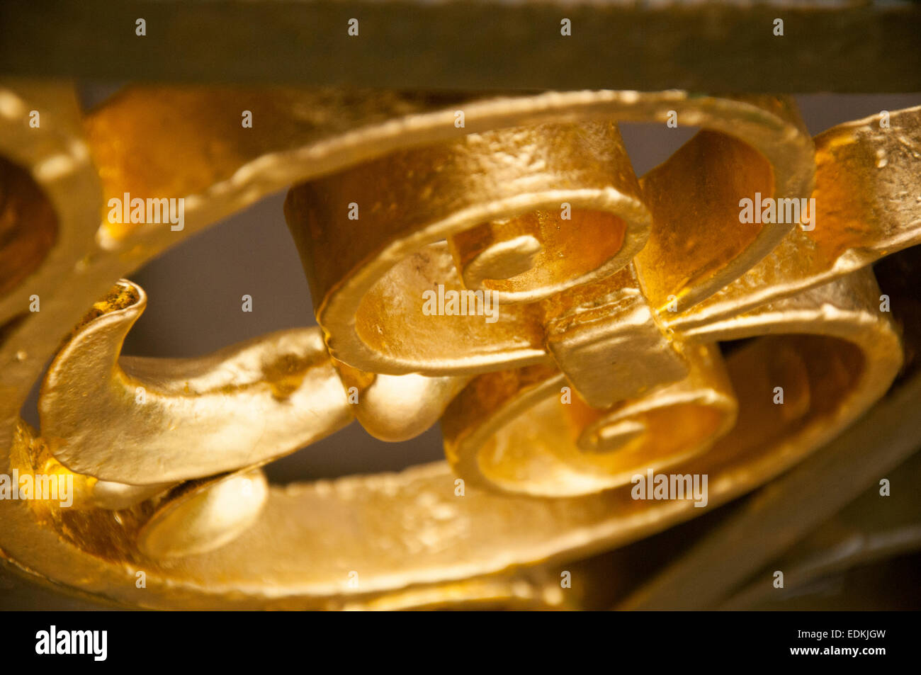 Close up of the ornate gold gates at the entrance to Chatsworth House ...