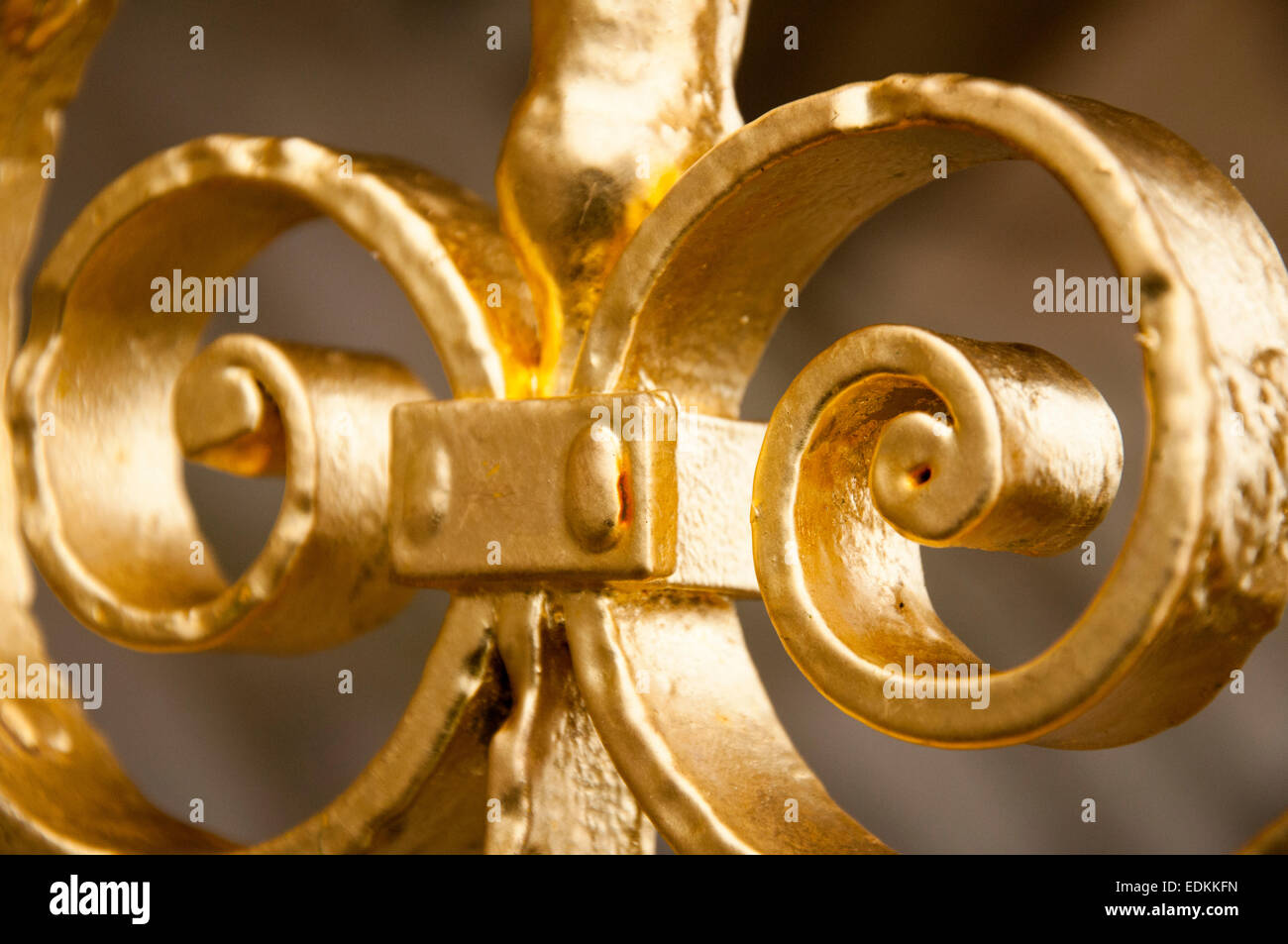 Close up of the ornate gold gates at the entrance to Chatsworth House ...