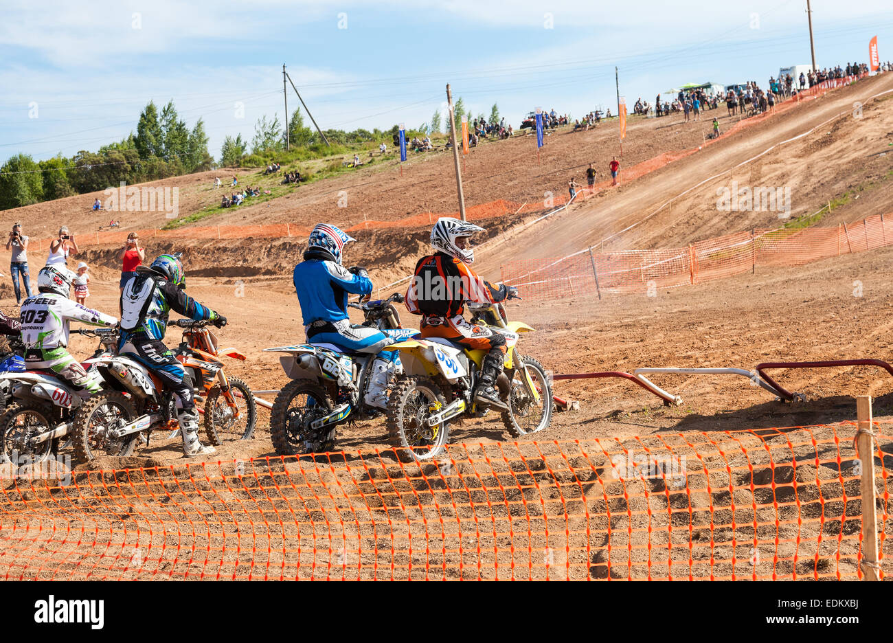 BOROVICHI, RUSSIA - JULY 12, 2014: Motocrossers in the starting line ...