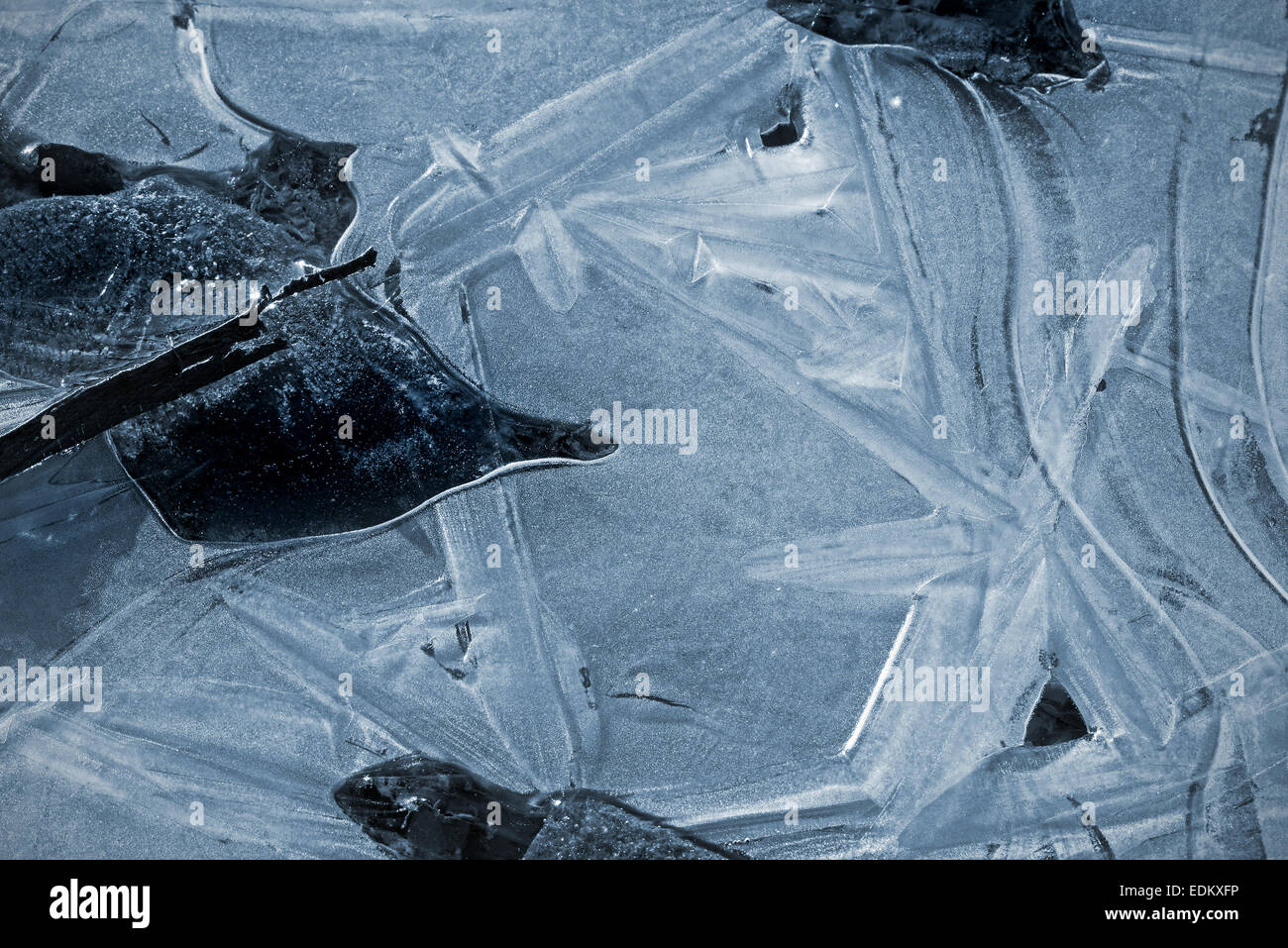 Frozen water in a lake making a star pattern. Close up. Abstract.Blue ...