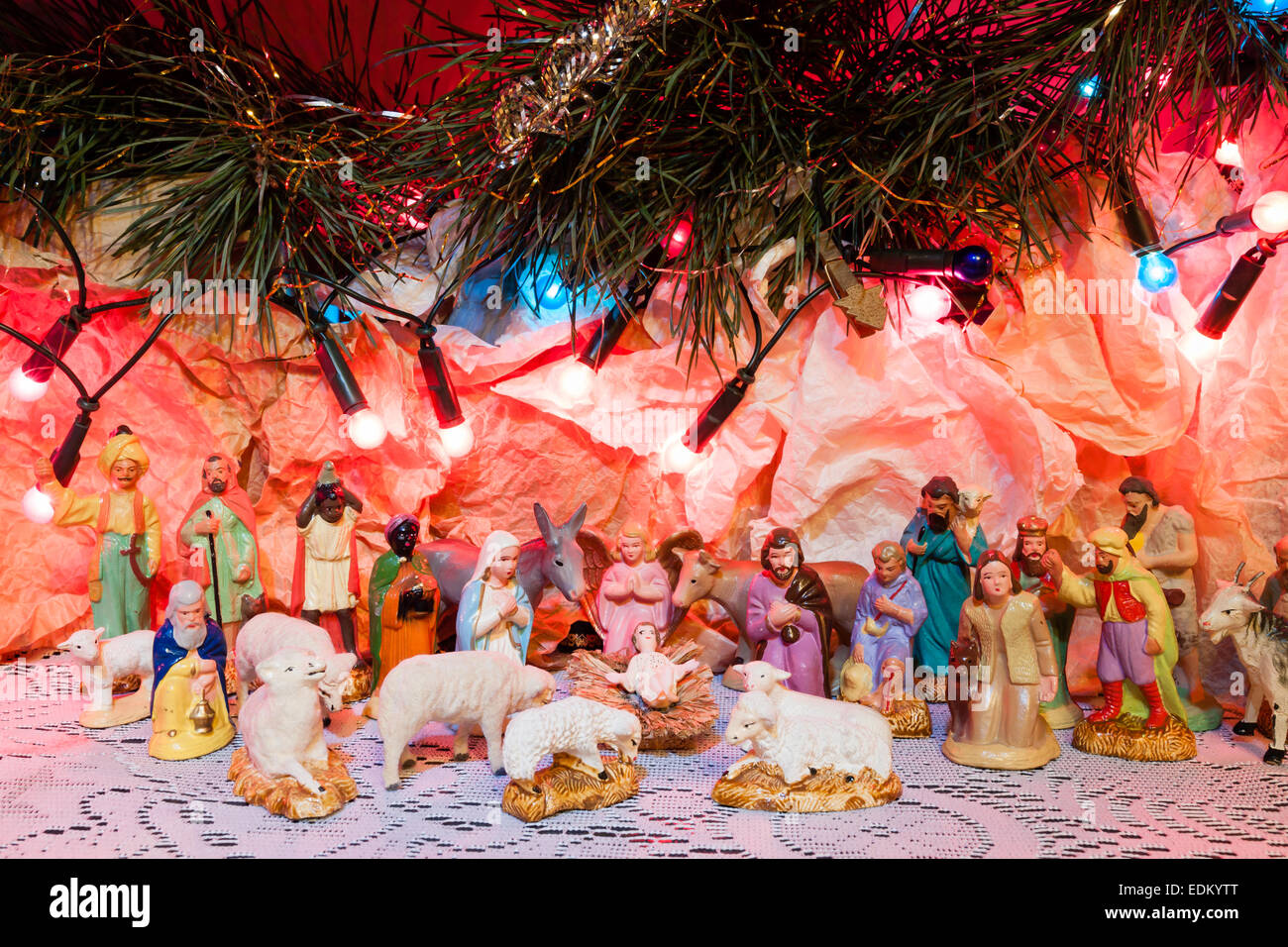 Nativity scene with colorful figurines of holy Mary Joseph Three Kings ...