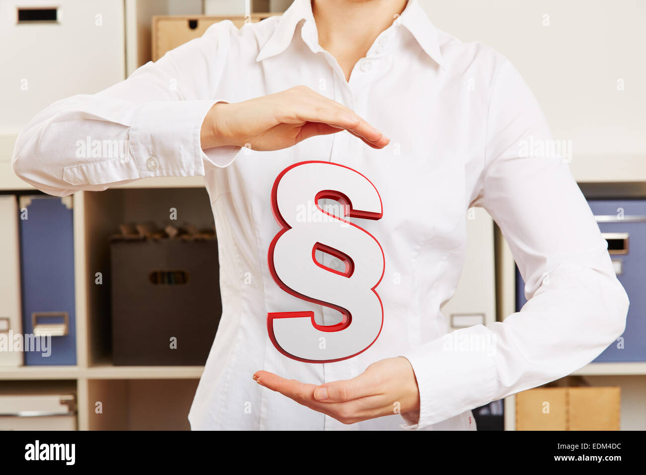 Woman holding hovering paragraph as symbol for imprint Stock Photo - Alamy