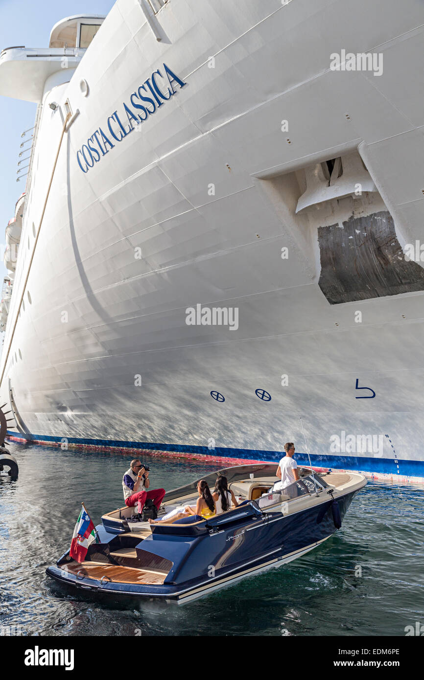 Costa Classica cruise ship moored in Trieste harbout with motor launch ...