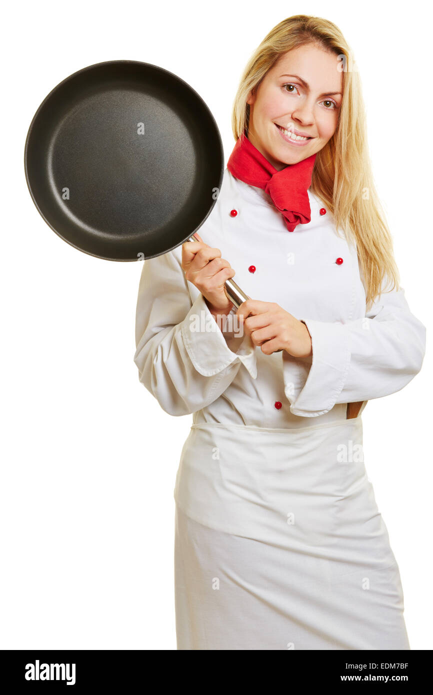 Smiling woman as cook in apprenticeship holding a frying pan Stock ...