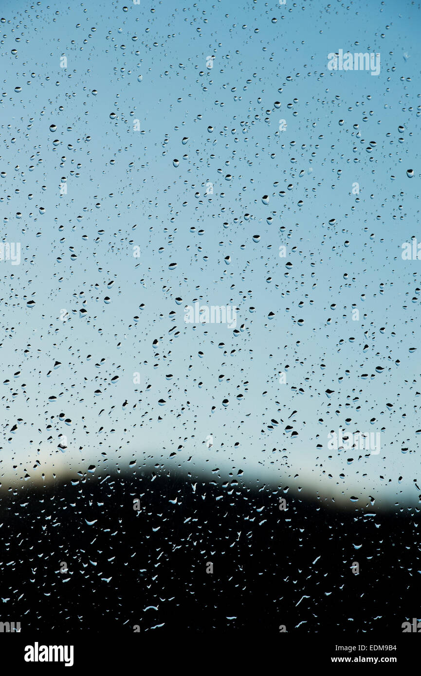 Raindrops on a window pane Stock Photo - Alamy