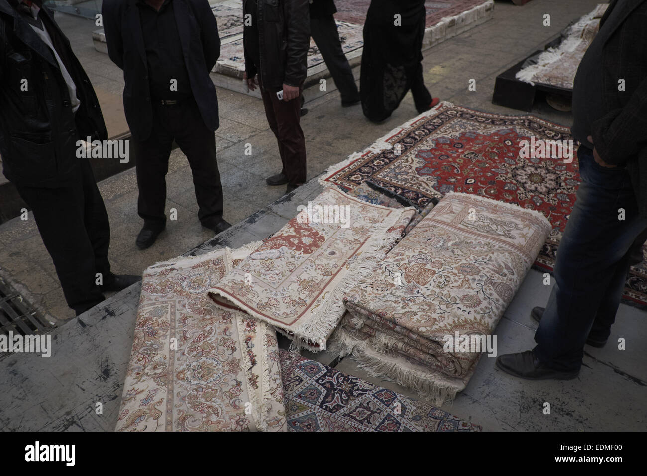 Tehran, Iran. 7th Jan, 2015. January 7, 2015 - Tehran, Iran - Men stand ...