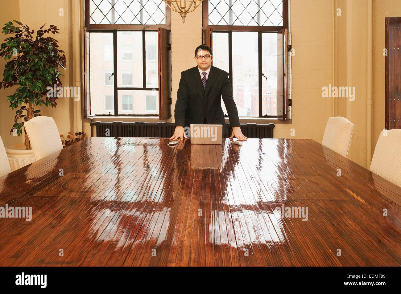 Male CEO at end of boardroom table Stock Photo - Alamy