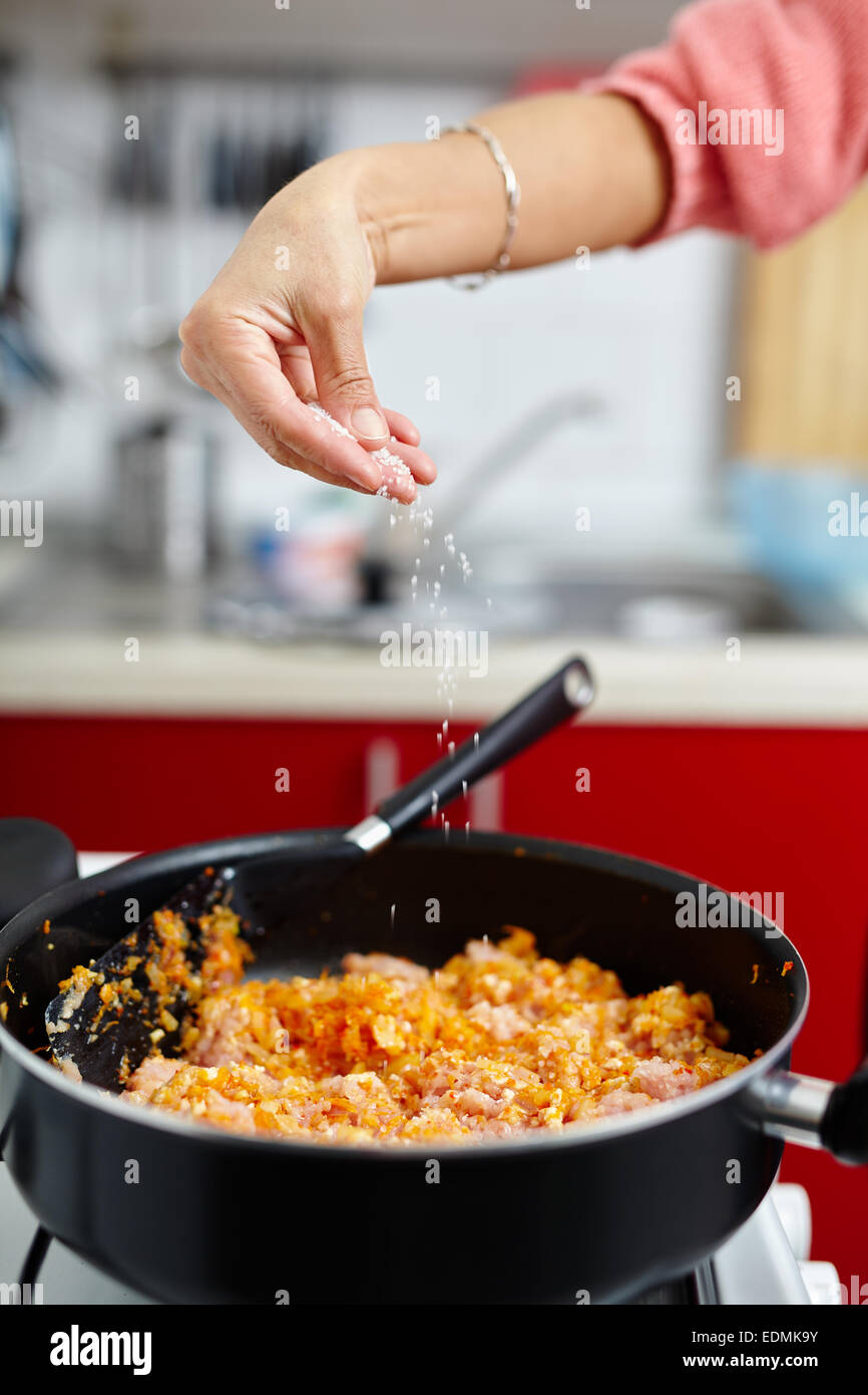 Woman pouring salt hands hi-res stock photography and images - Alamy