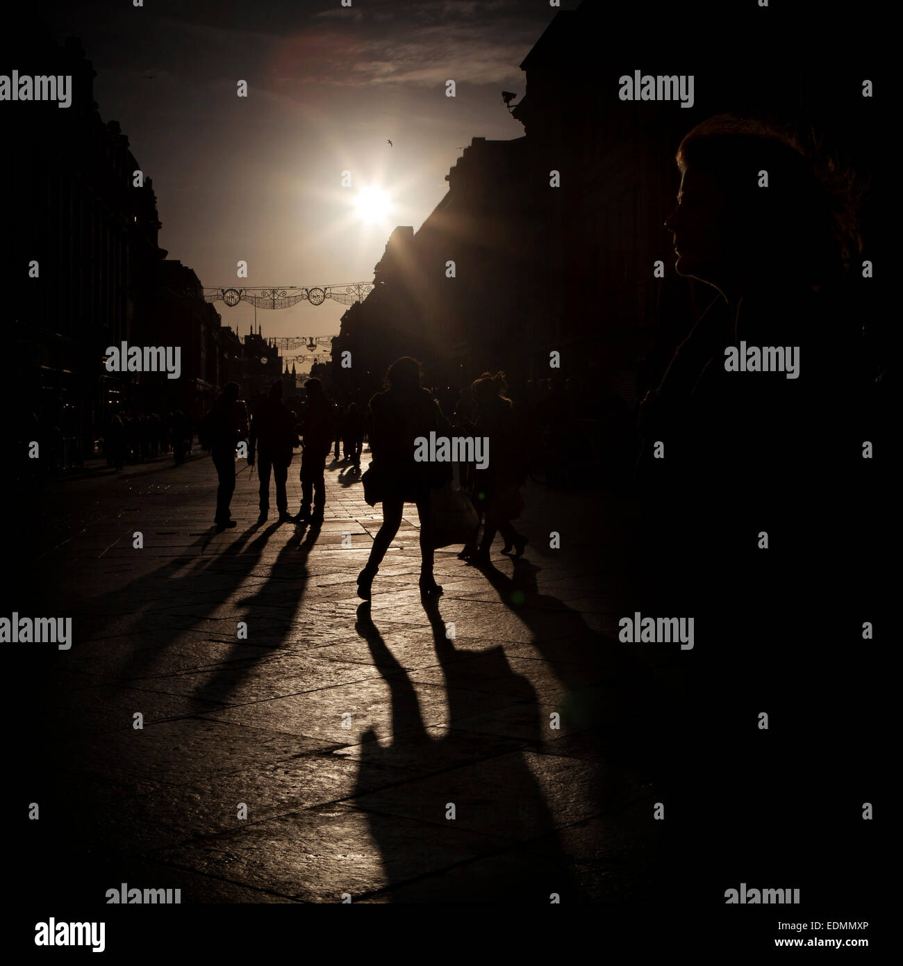 People walking down the high street in the late afternoon Stock Photo ...