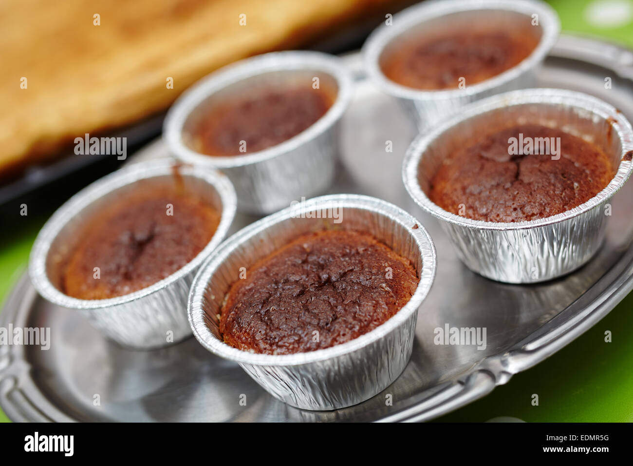 Chocolate lava cake in baking cups on a tray, closeup Stock Photo - Alamy