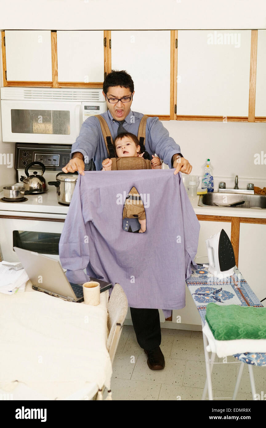 Father multitasking at home Stock Photo - Alamy