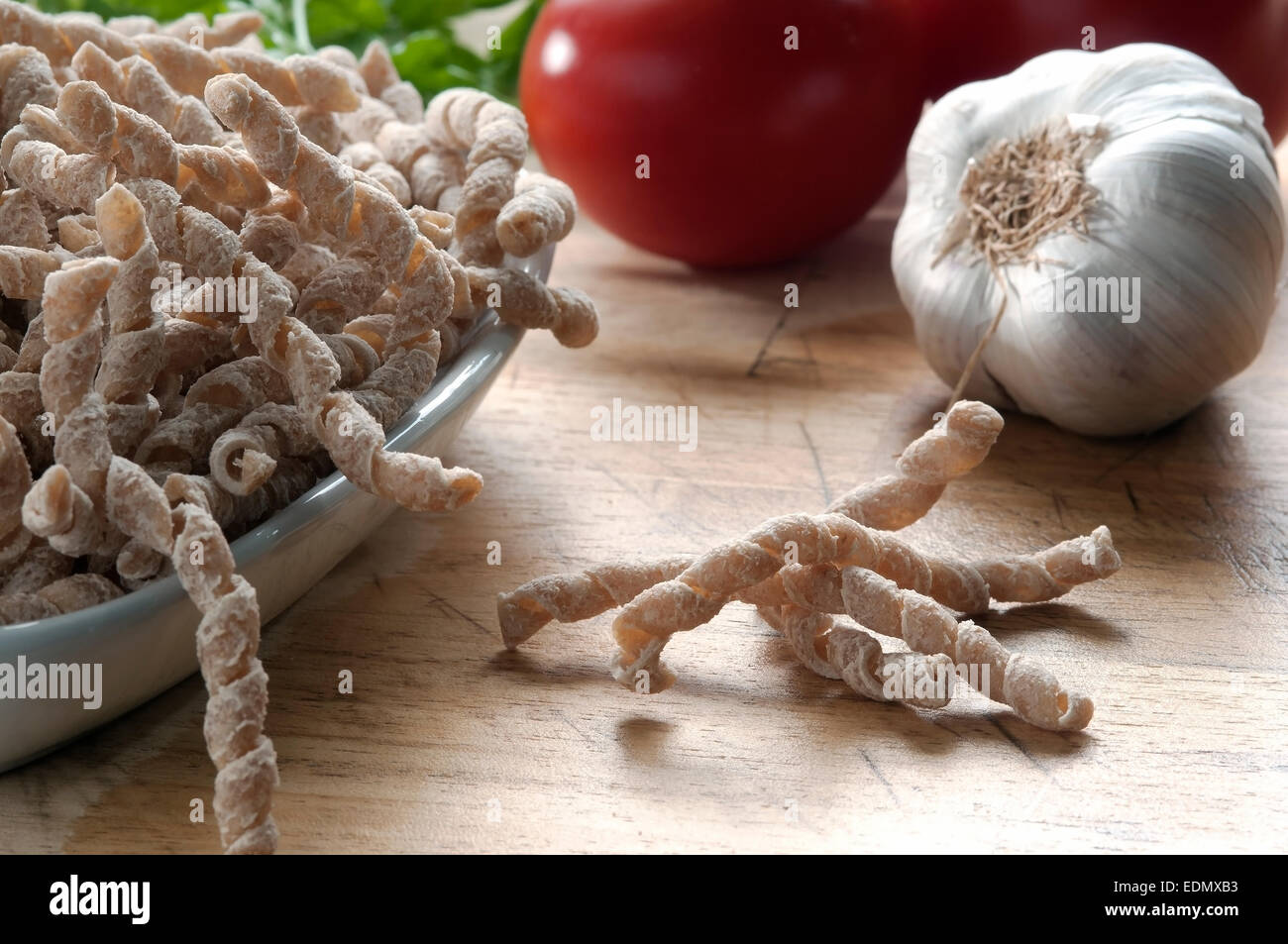 corkscrew shaped raw pasta called busiate with whole wheat flour of ...