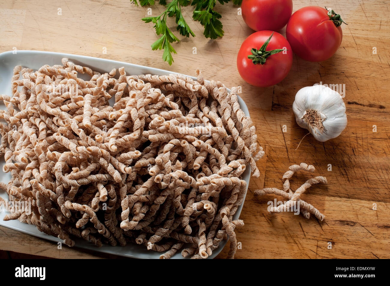 corkscrew shaped raw pasta called busiate with whole wheat flour of ...