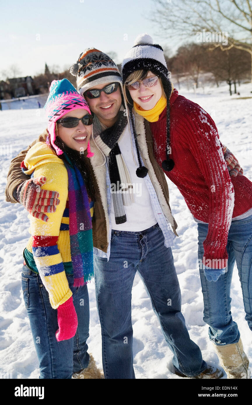 Friends playing outside in winter Stock Photo - Alamy