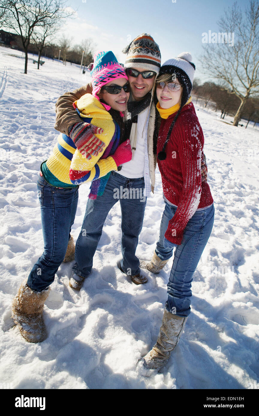 Friends playing outside in winter Stock Photo - Alamy