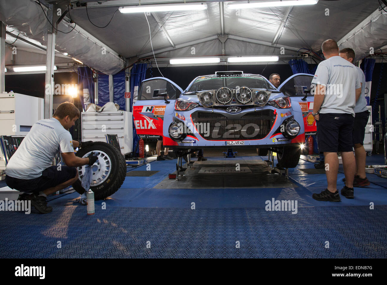 Mechanics prepare the Team Hyundai World Rally Championship car of ...