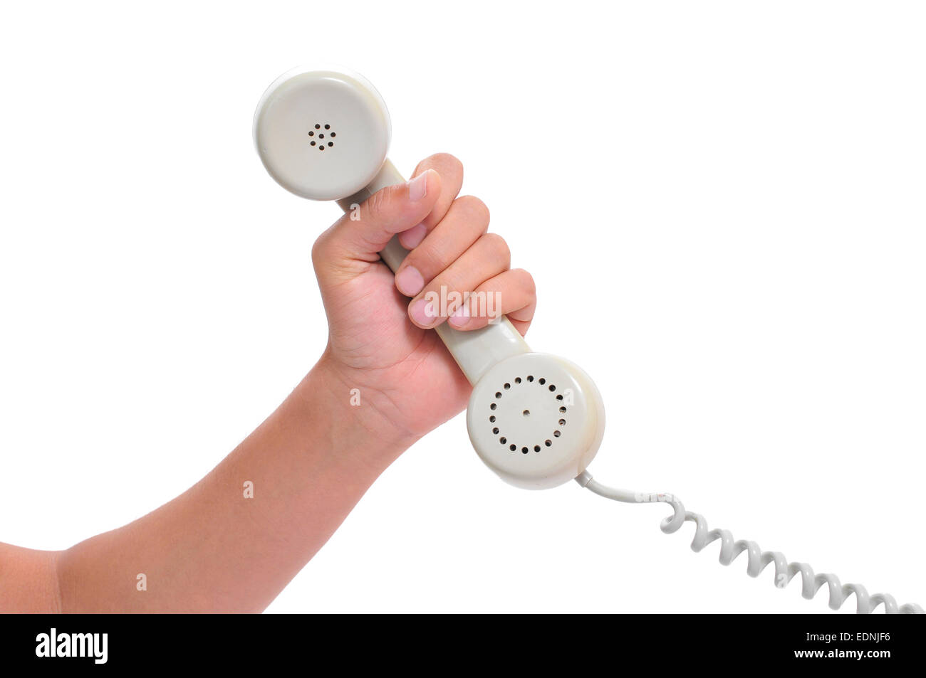 closeup of the hand of a young man holding the handset of a telephone ...
