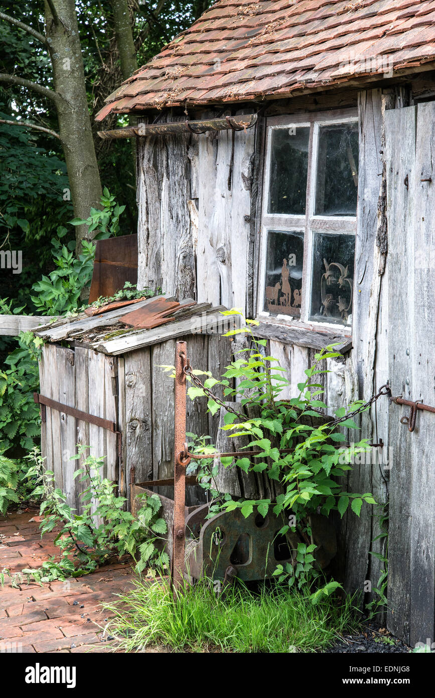 Medieval ironmonger shed in forest landscape setting Stock Photo - Alamy